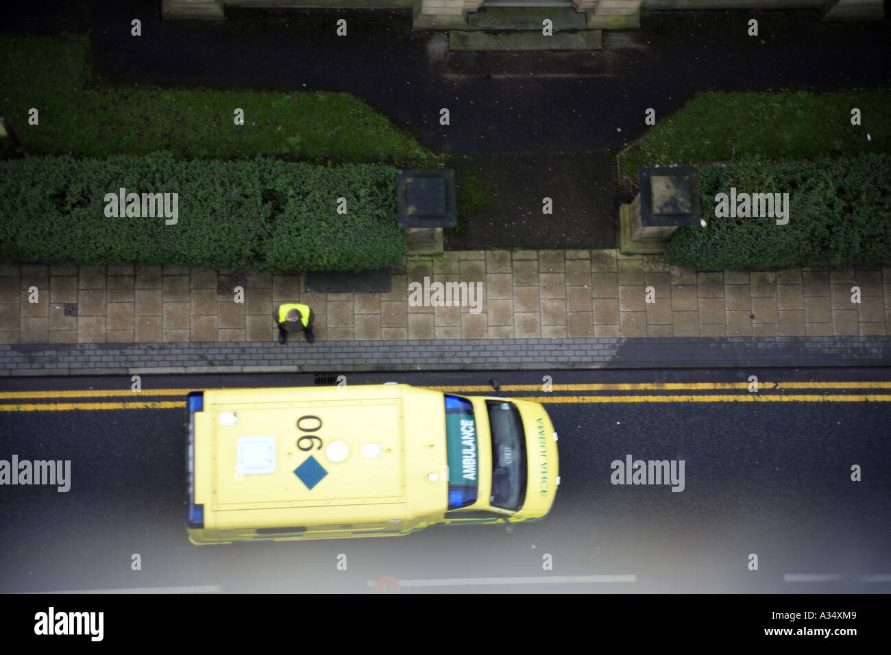 Aerial view of ambulance travelling along a road during an emergency ...