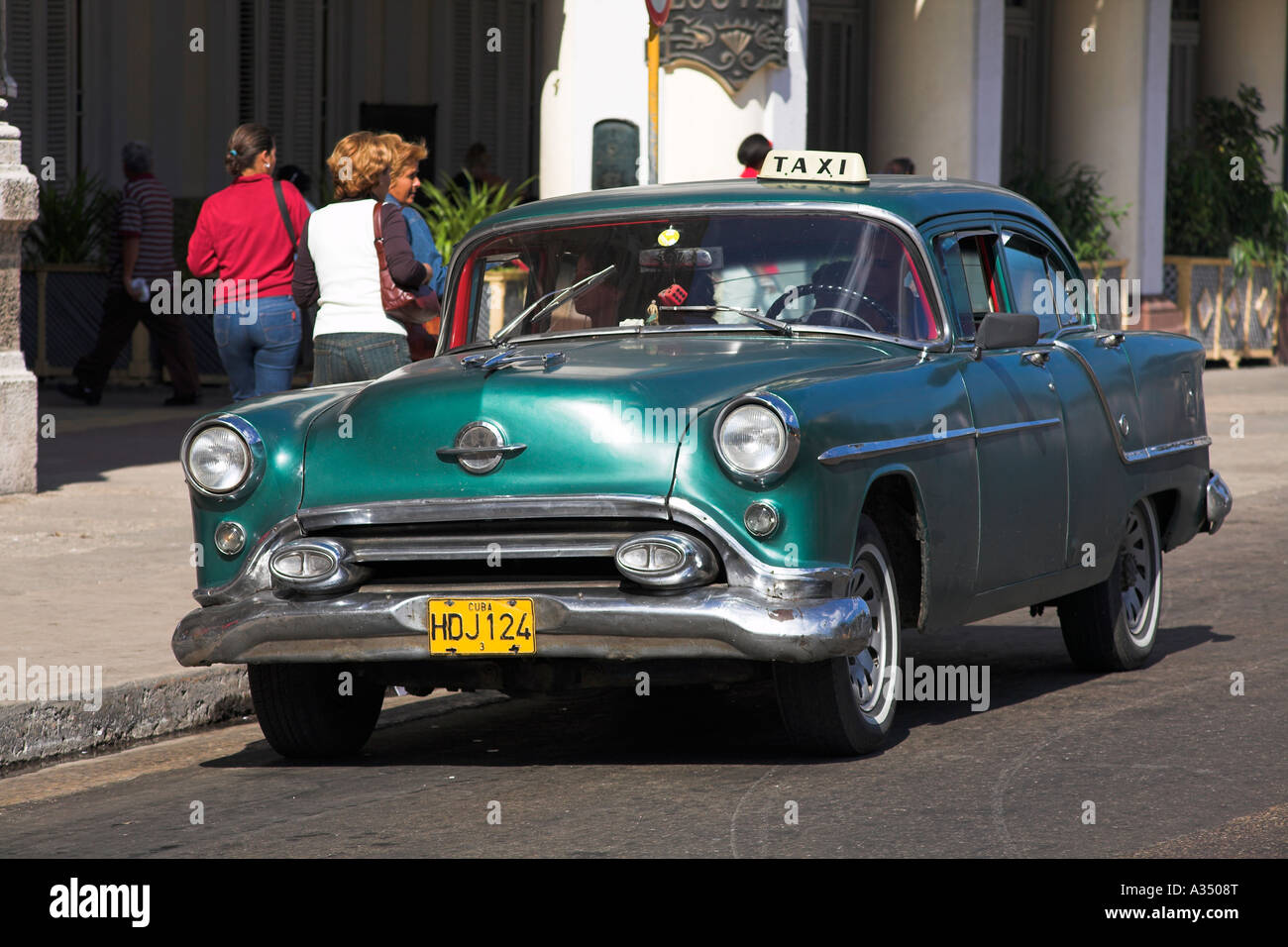 Classic green taxi parked on the roadside, Havana, Cuba Stock Photo - Alamy
