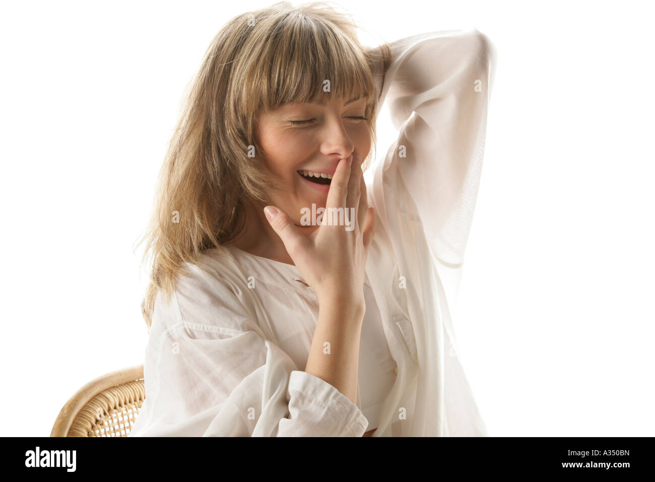 Young woman yawning Stock Photo - Alamy