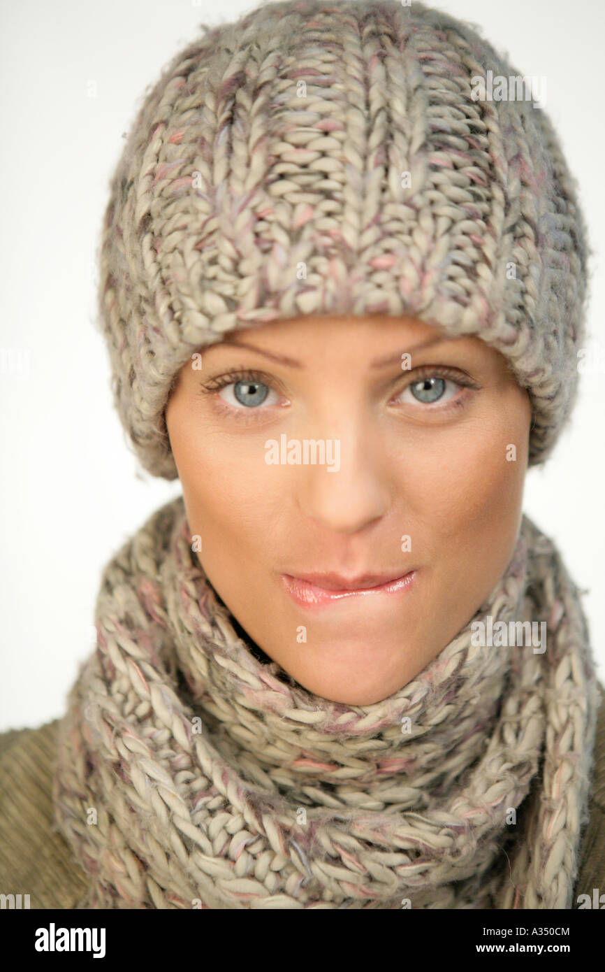 Woman wearing wooly cap and scarf Stock Photo - Alamy