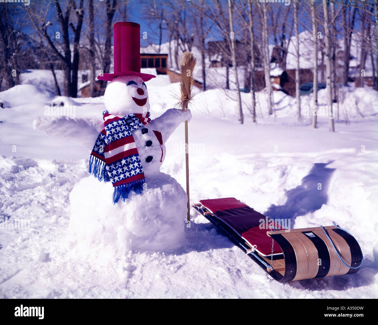 Jaunty snowman smiling as he enjoys a bright sunny Winter afternoon ...
