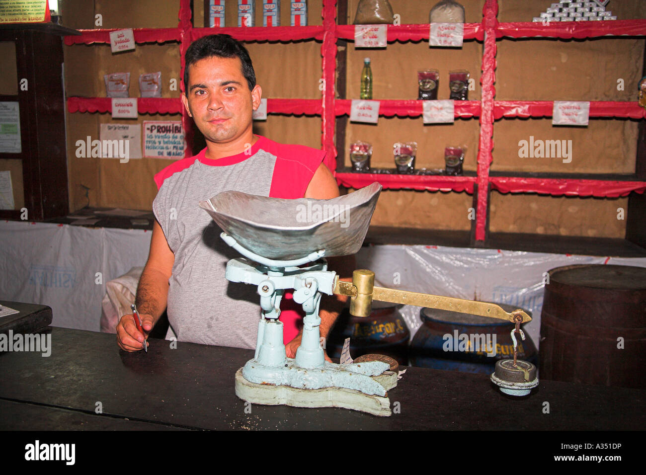 Shopkeeper posing in a ration card shop, Sancti Spiritus, Sancti ...