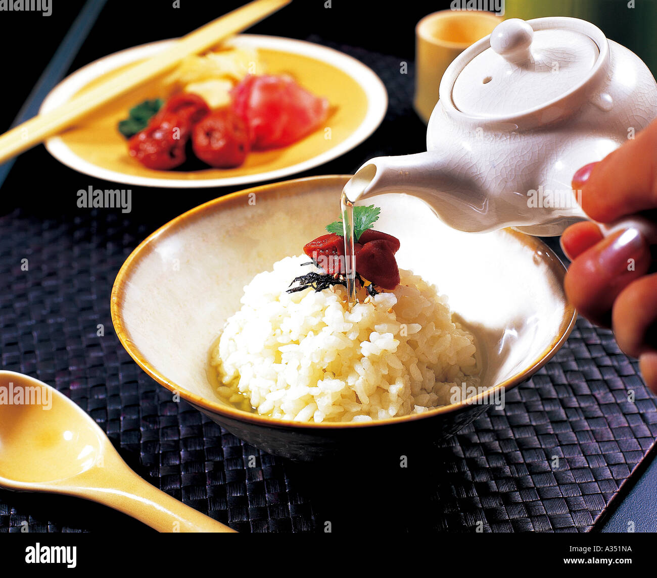 A Japanese dish with tea poured on cooked rice Stock Photo - Alamy