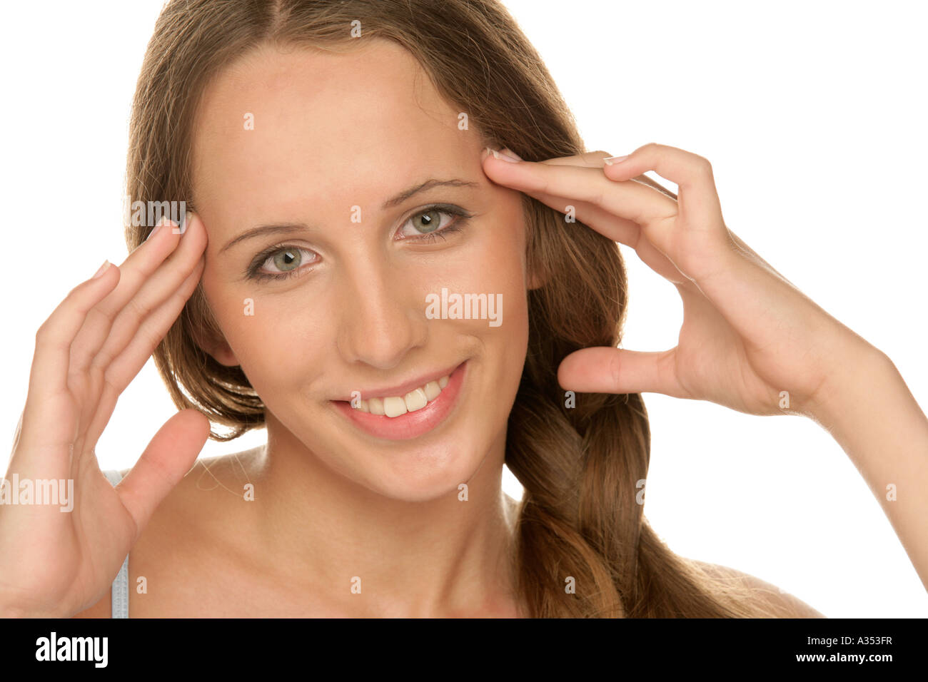 Young woman touching her temples Stock Photo - Alamy