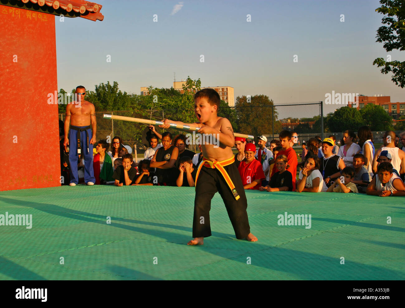 Toronto, Ontario, Canada. A boy with a wooden pole demonstrating a ...