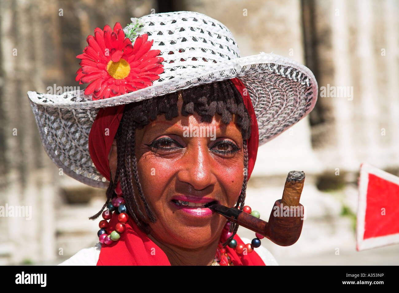 Colourful lady smoking a pipe and cigar, Plaza de la Catedral, Havana ...
