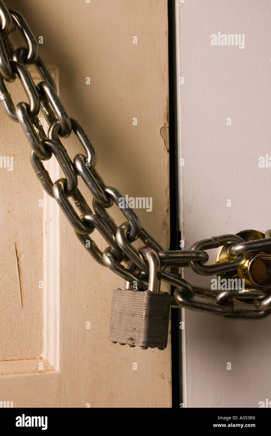 Doors with chain and lock Stock Photo - Alamy