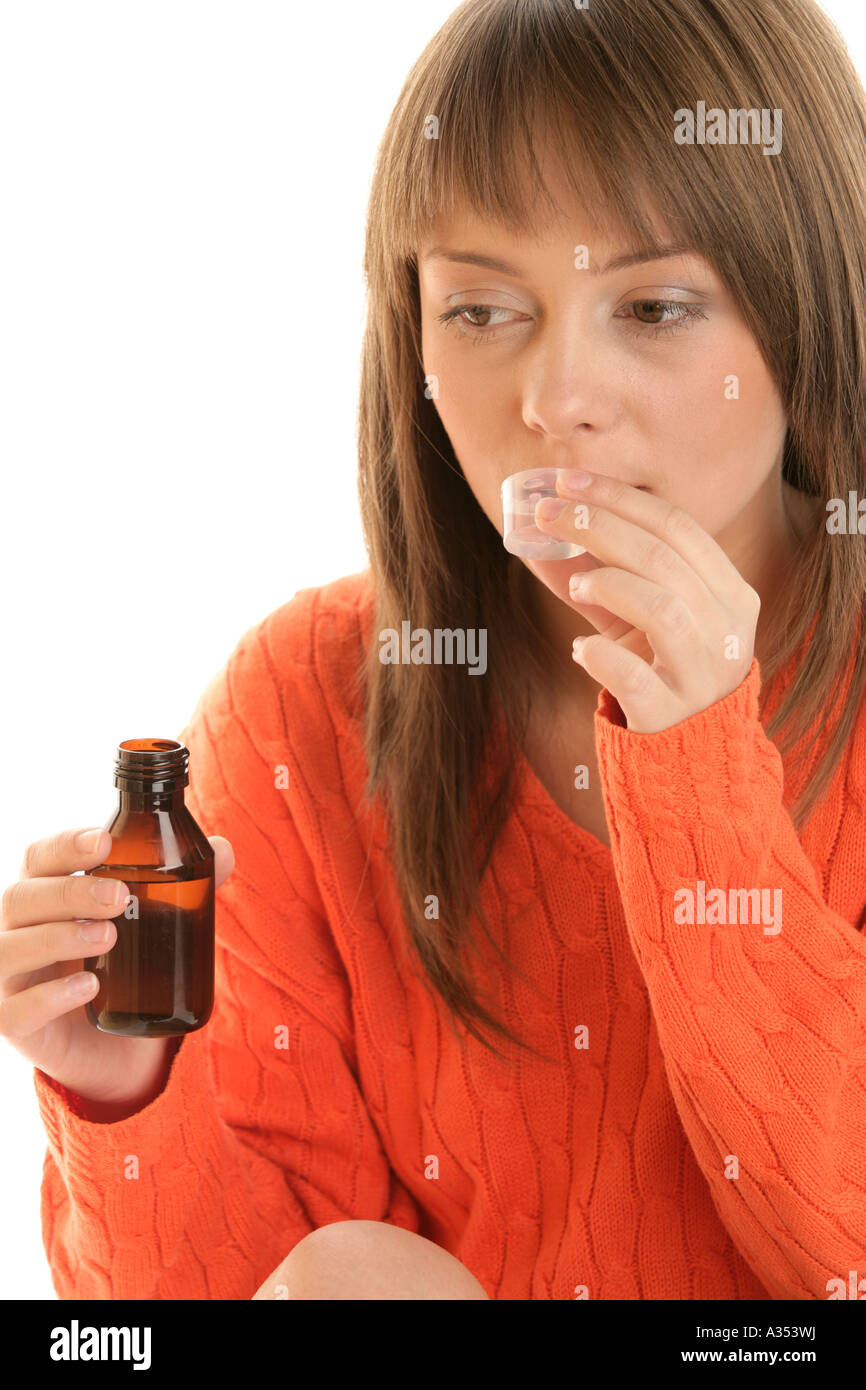 Woman taking medicine Stock Photo - Alamy