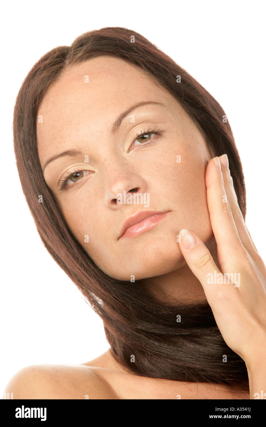 Portrait of woman touching her cheek Stock Photo - Alamy