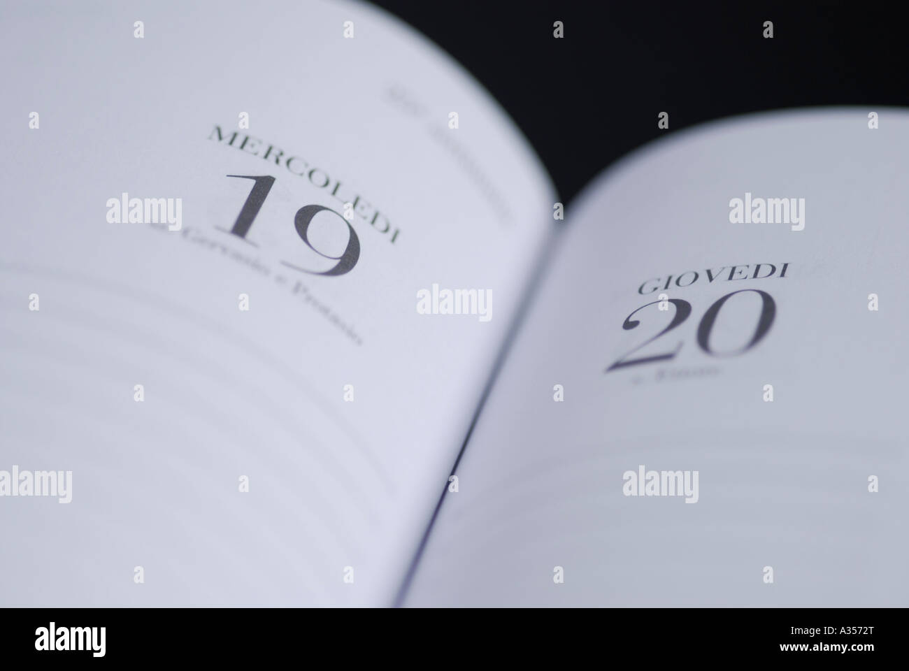 Two pages of an Italian diary showing Wednesday and Thursday Stock ...