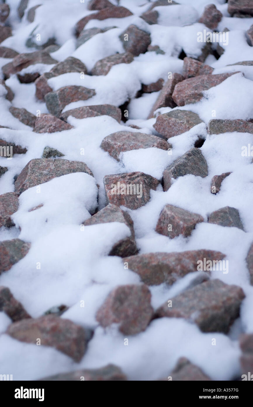 Stock Image of Grey and Red Rocks Covered in Snow Stock Photo - Alamy