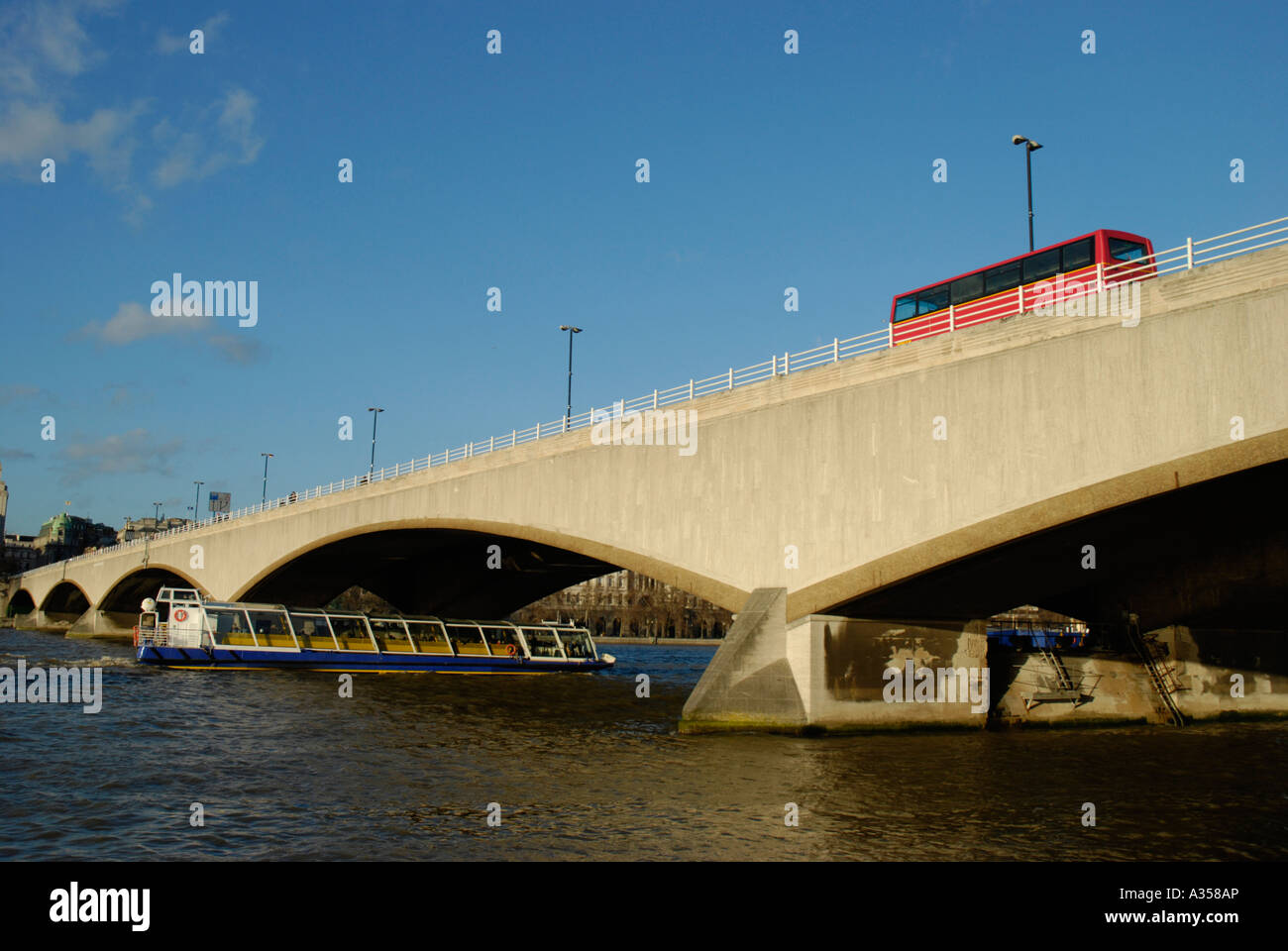 Boat passing under Waterloo Bridge, London, England Stock Photo - Alamy