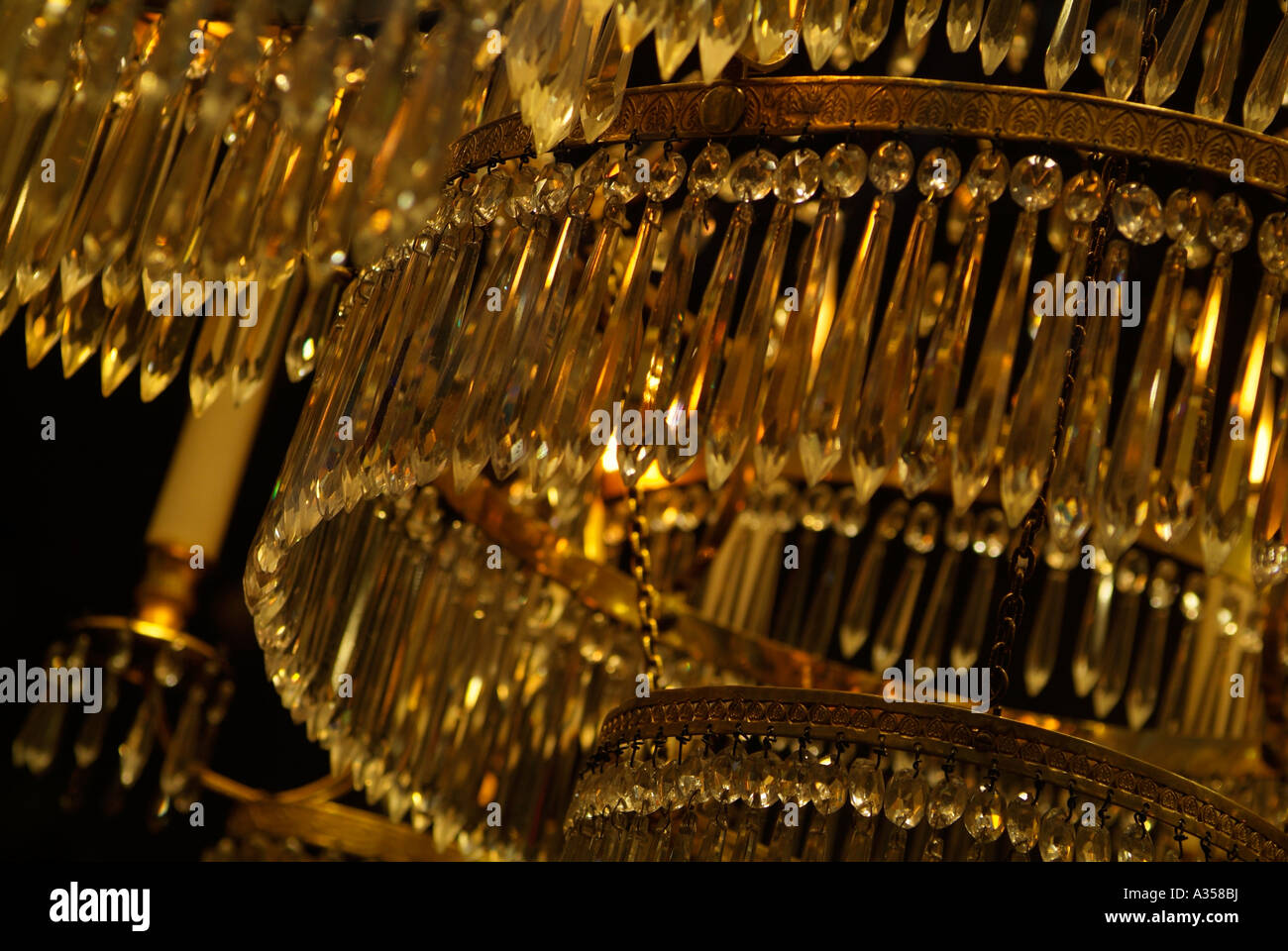 A elaborate crystal chandelier hanging in a store Stock Photo - Alamy