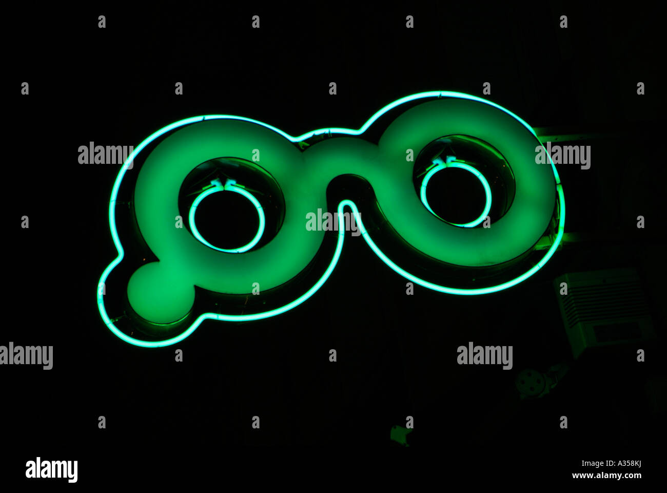 A optician sign which is a pair of green glasses lit up. Paris, France ...