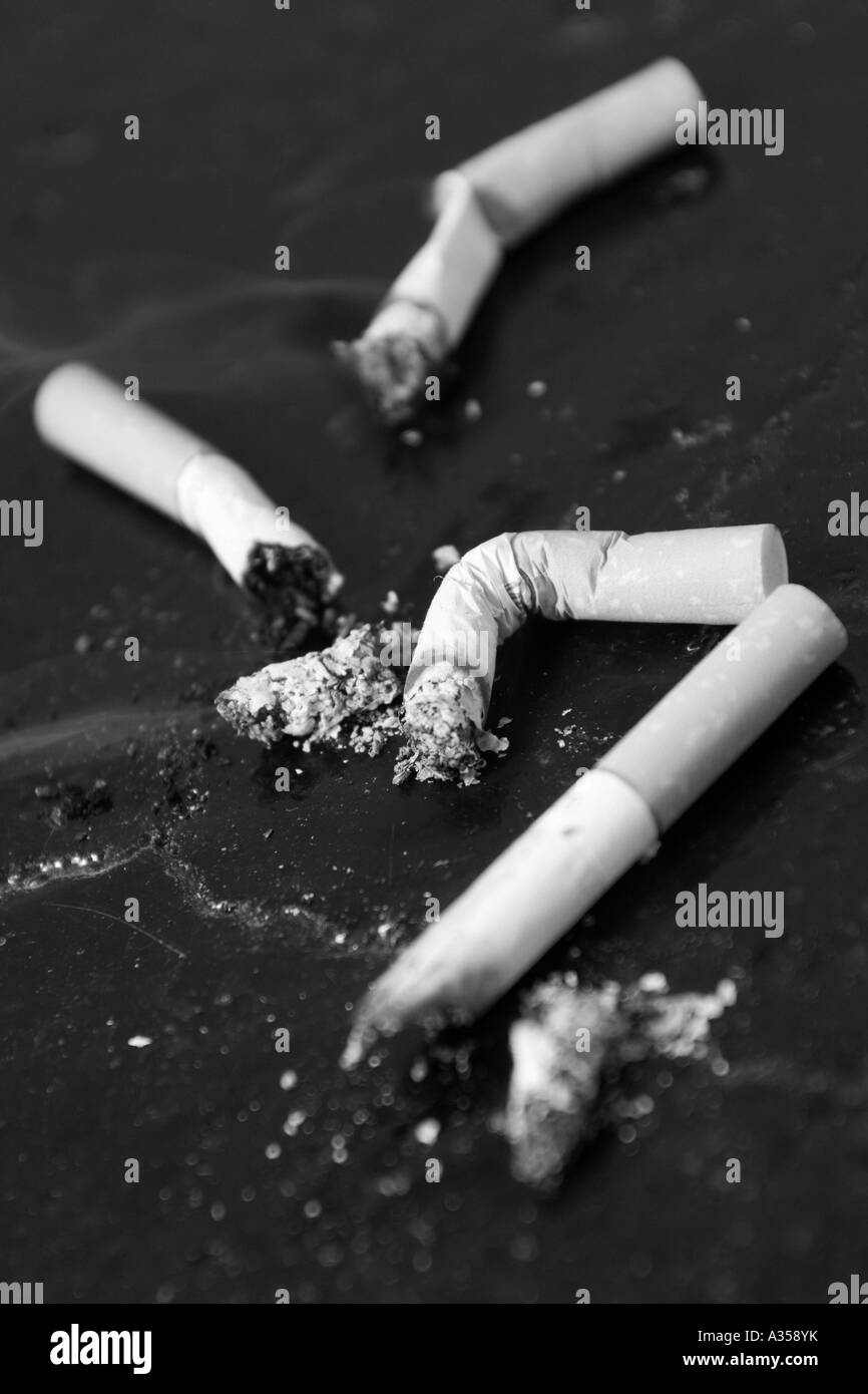 cigarettes stubbed out on the floor Stock Photo - Alamy