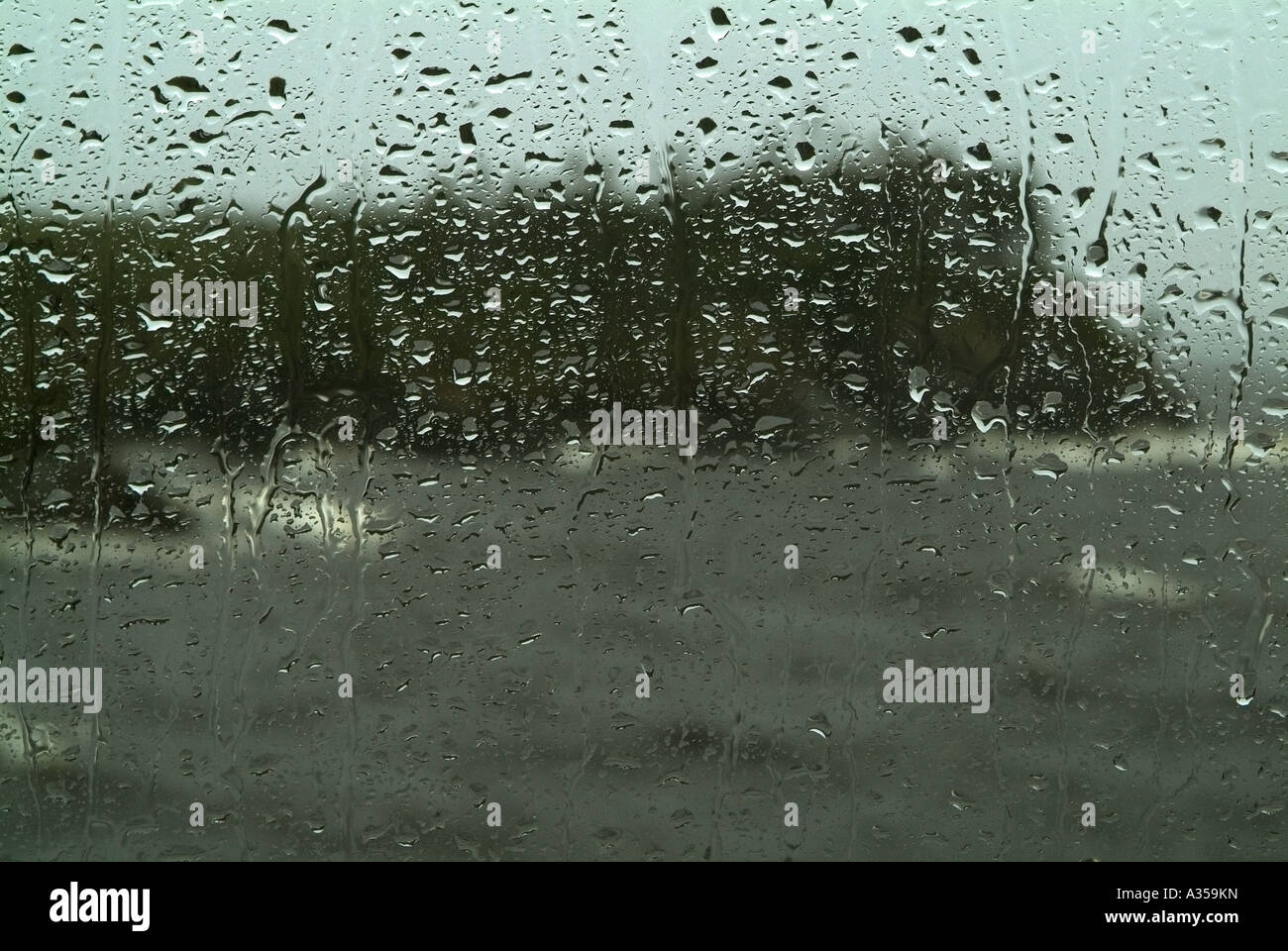 Looking through a rainy window at Kaegudeck Lake, Newfoundland, Canada ...