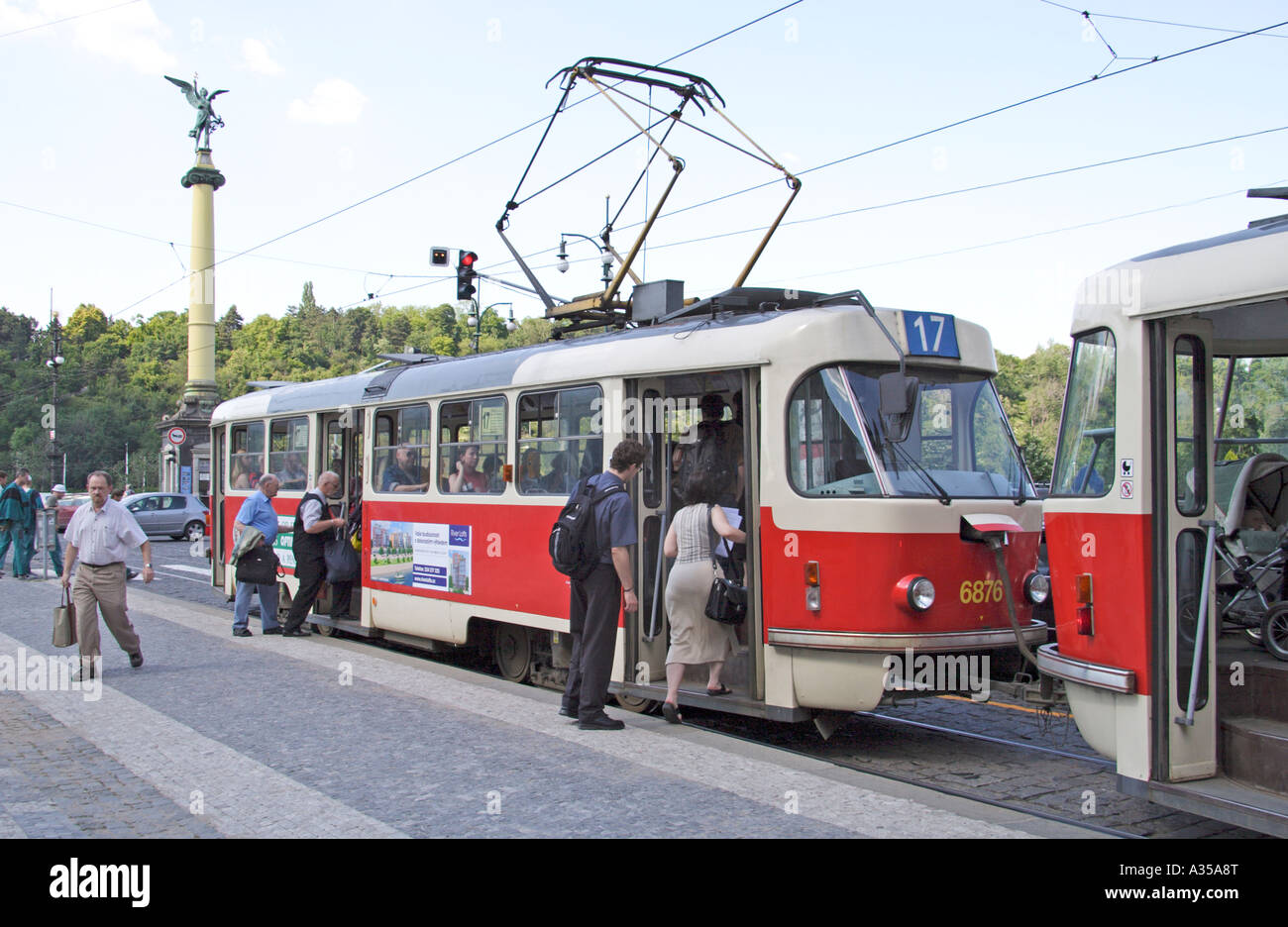 Passengers boarding tram on route 17 at Chechuv bridge, Prague Stock ...