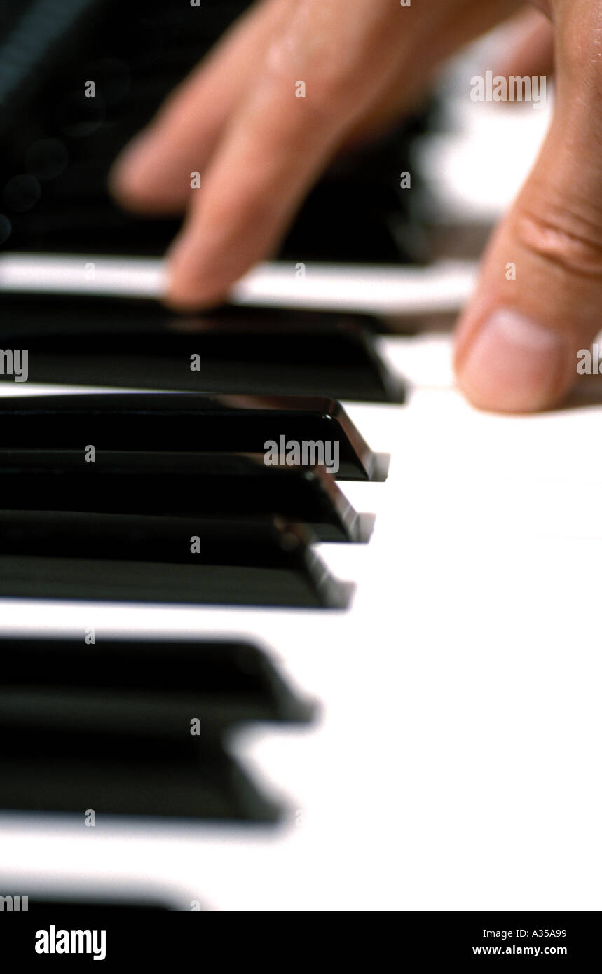 Fingers on piano keyboard Stock Photo - Alamy