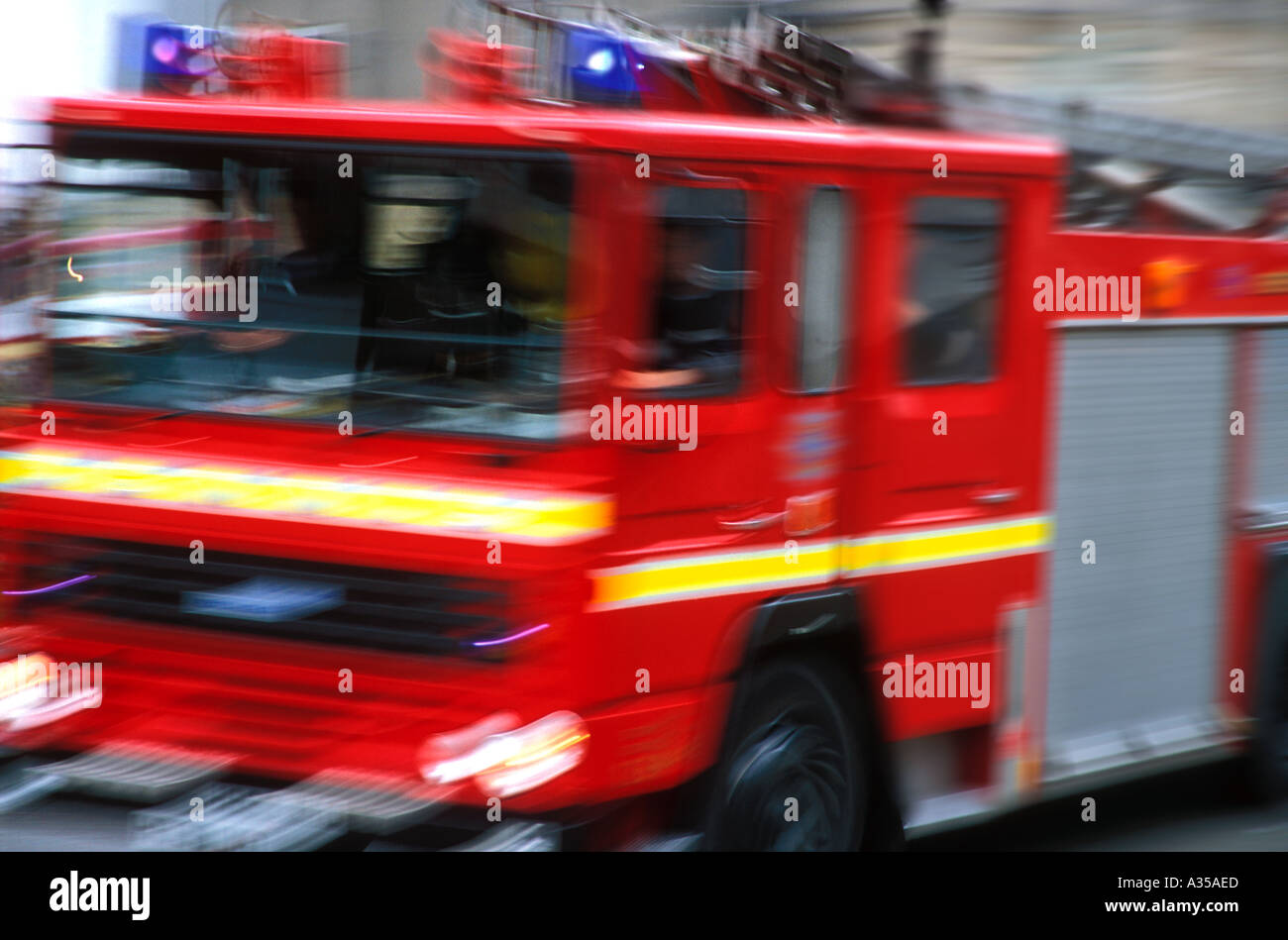 Fire engine speeding to fire England Stock Photo - Alamy