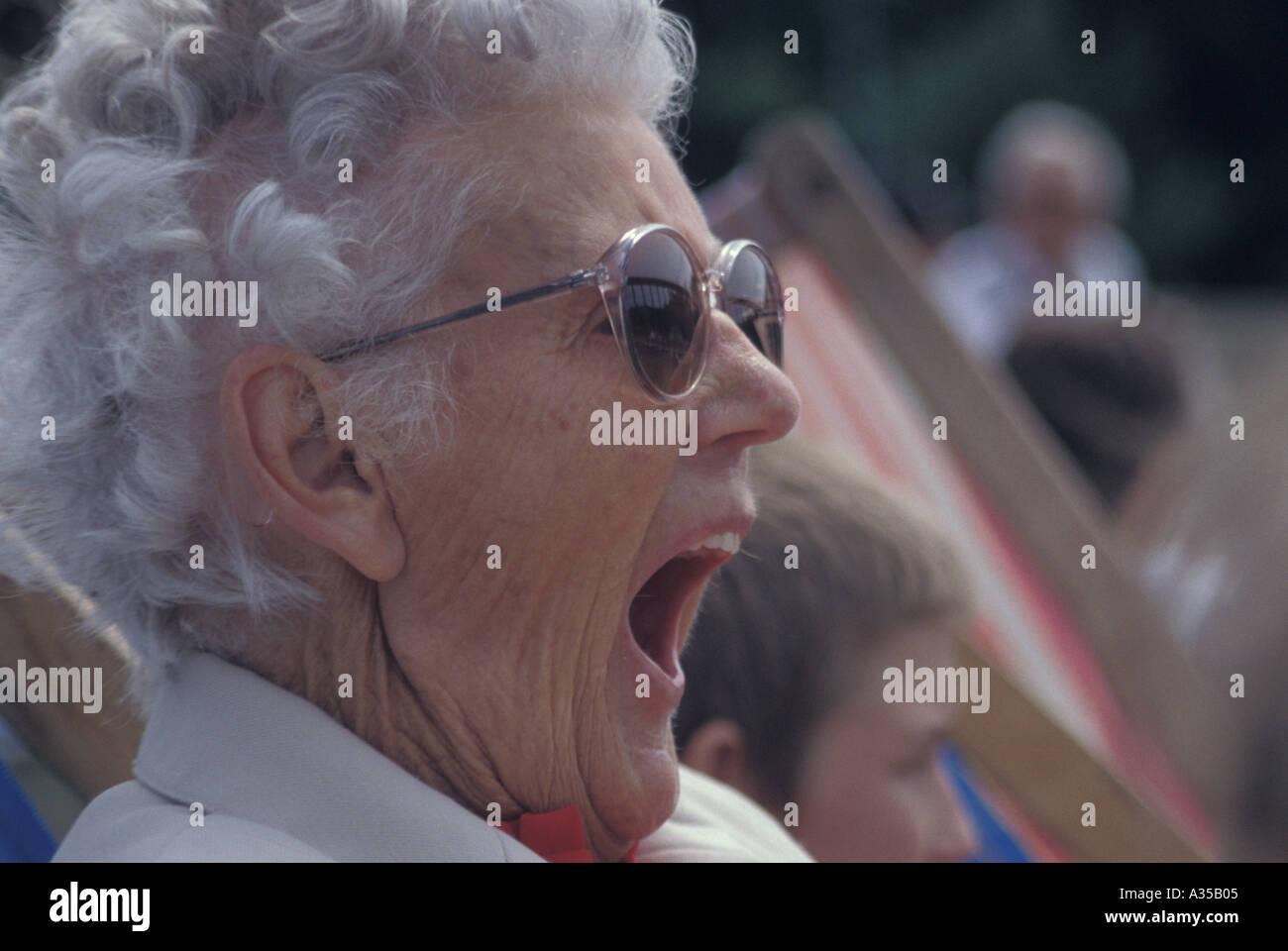 Old Woman Yawning Stock Photo - Alamy