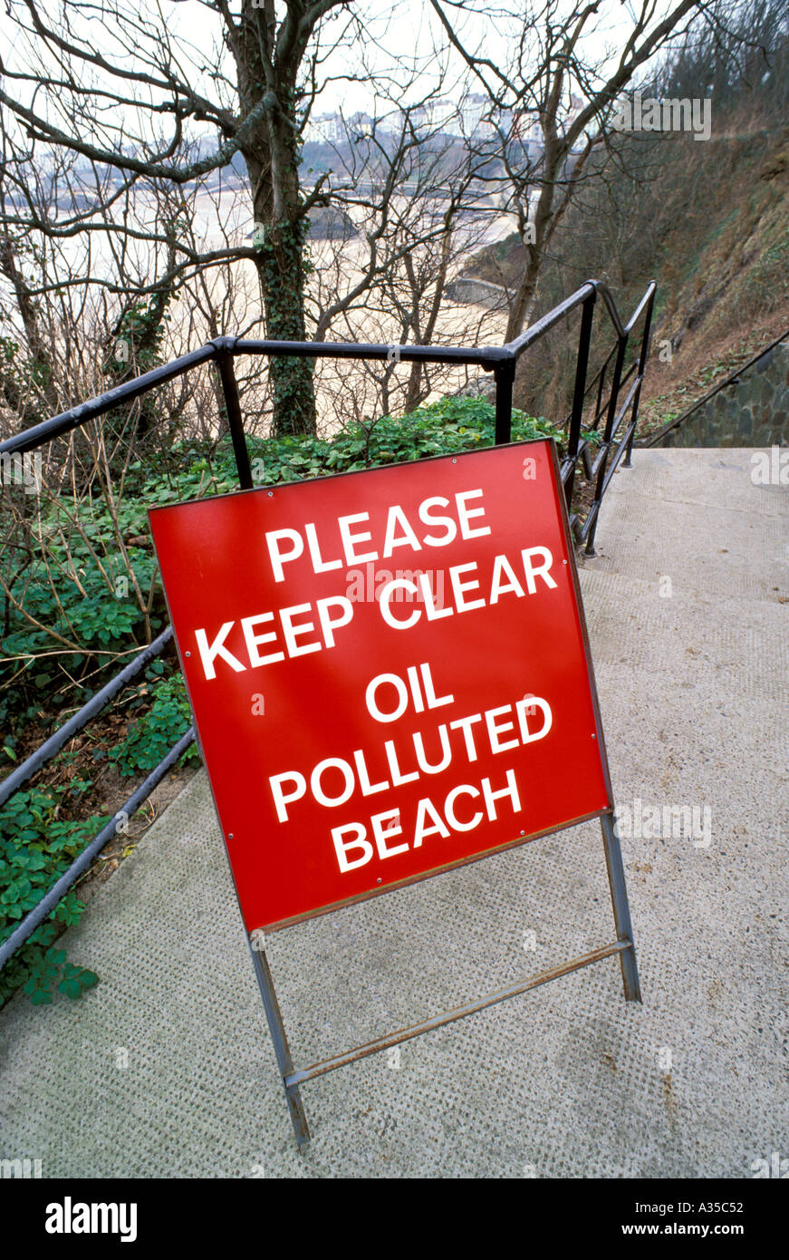 Oil pollution warning sign, Tenby, Wales, 1996 Stock Photo - Alamy