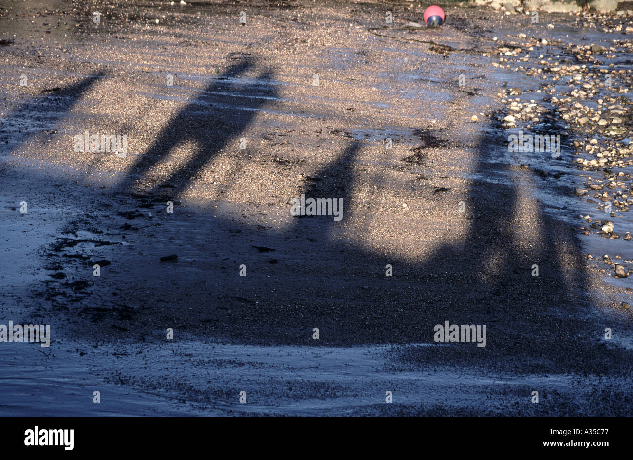 Shadows on the Beach Stock Photo - Alamy