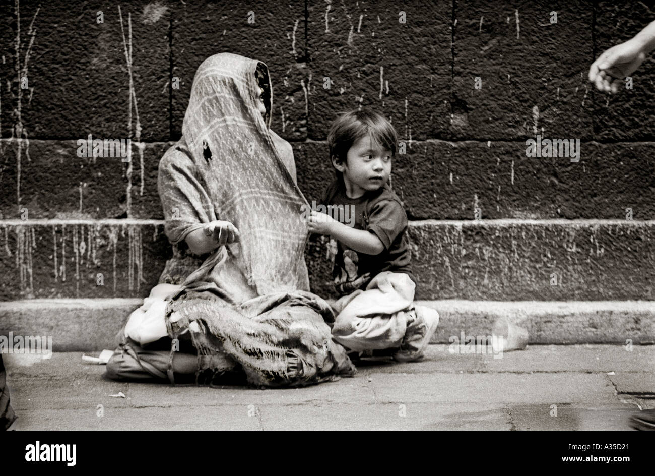 Woman with child begging in the street Mexico City Stock Photo: 220449 ...