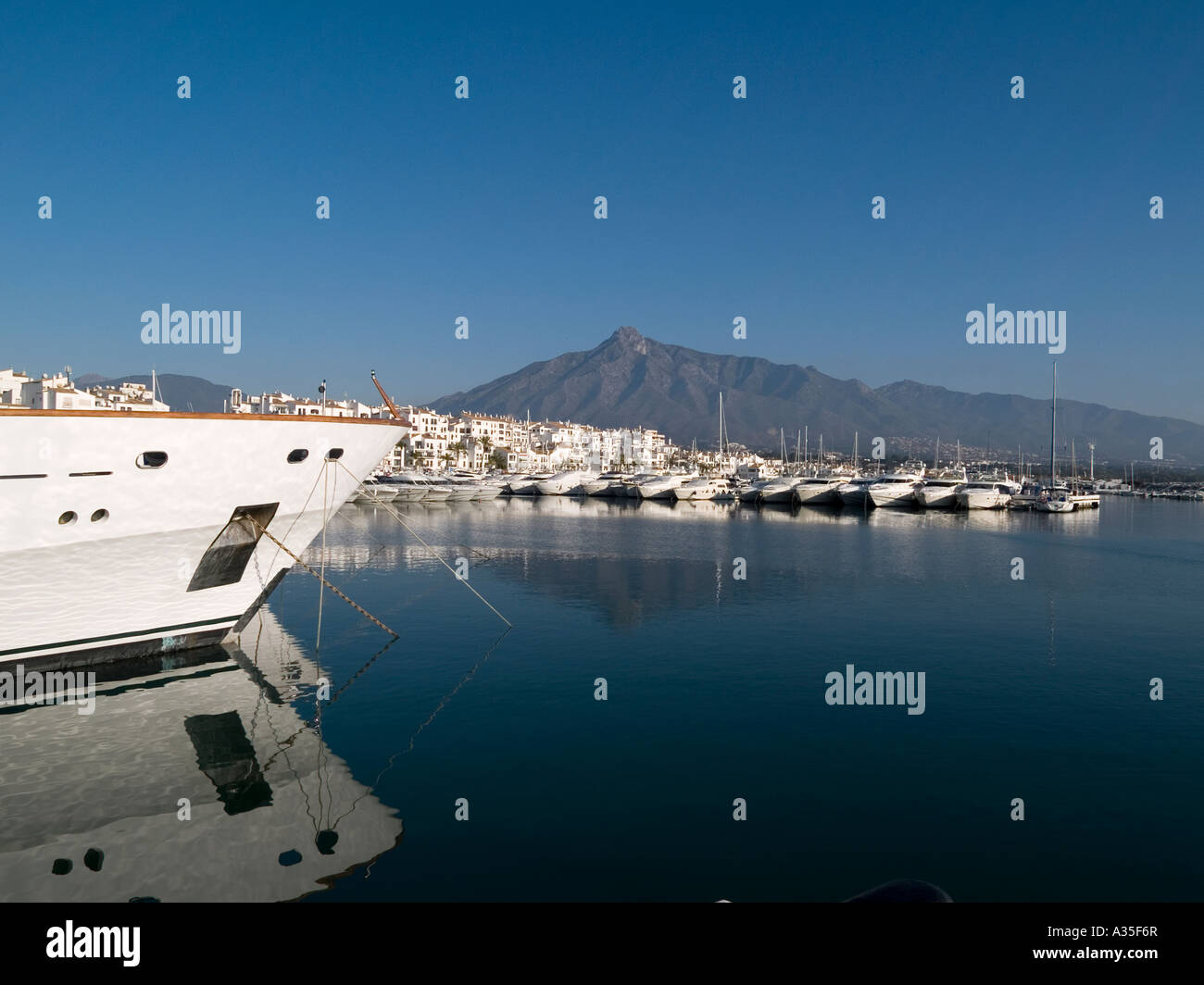 Yacht harbour with mountain backdrop at Puerto Banus Marbella Andalusia ...