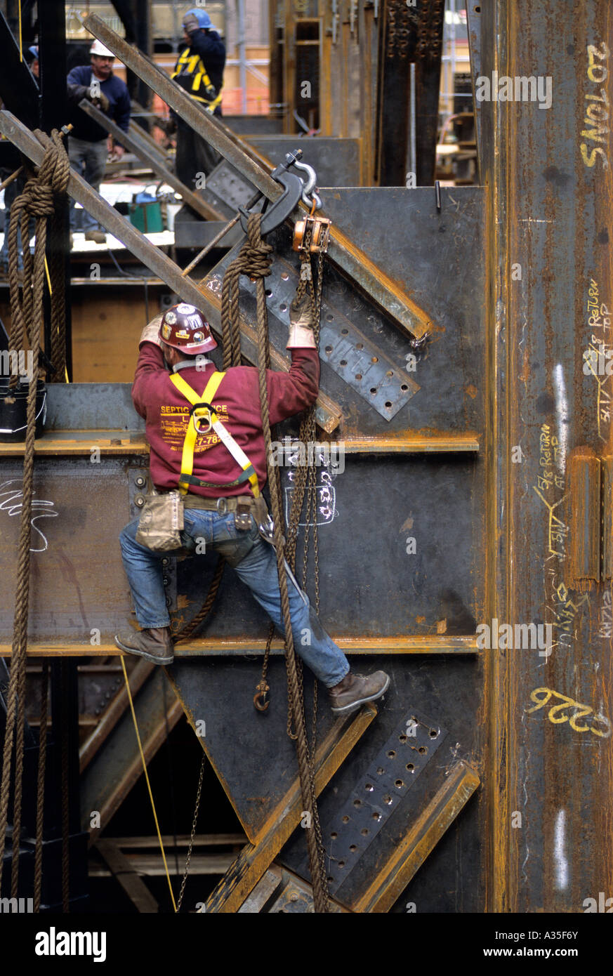 Iron worker connector works on new skyscraper in New York City Stock ...