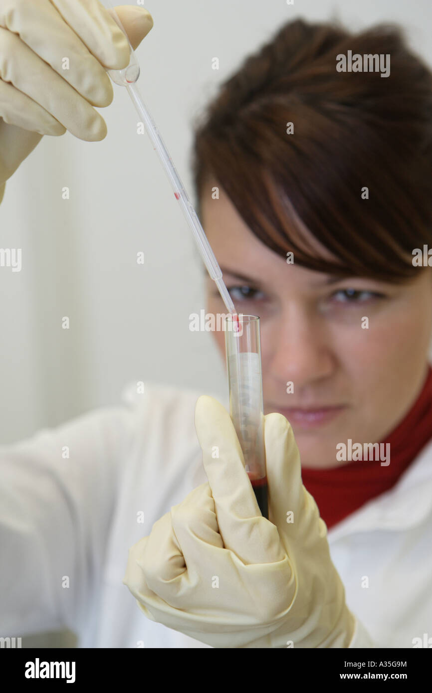 Laboratory technician in the laboratory with a blood test Stock Photo ...