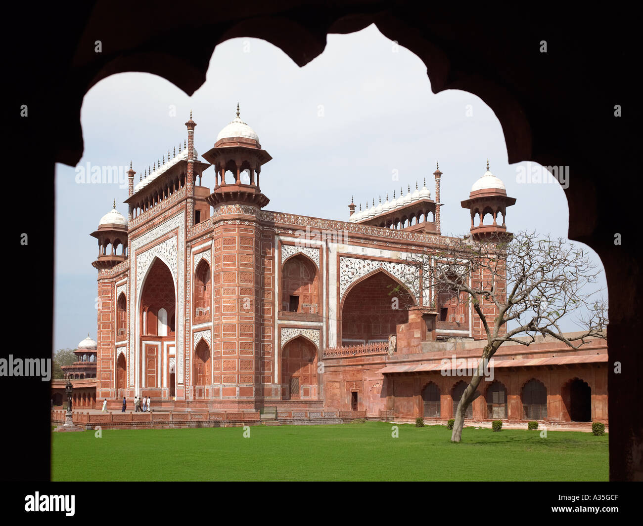 Gateway to the Taj Mahal viewed through a small archway Agra, India ...