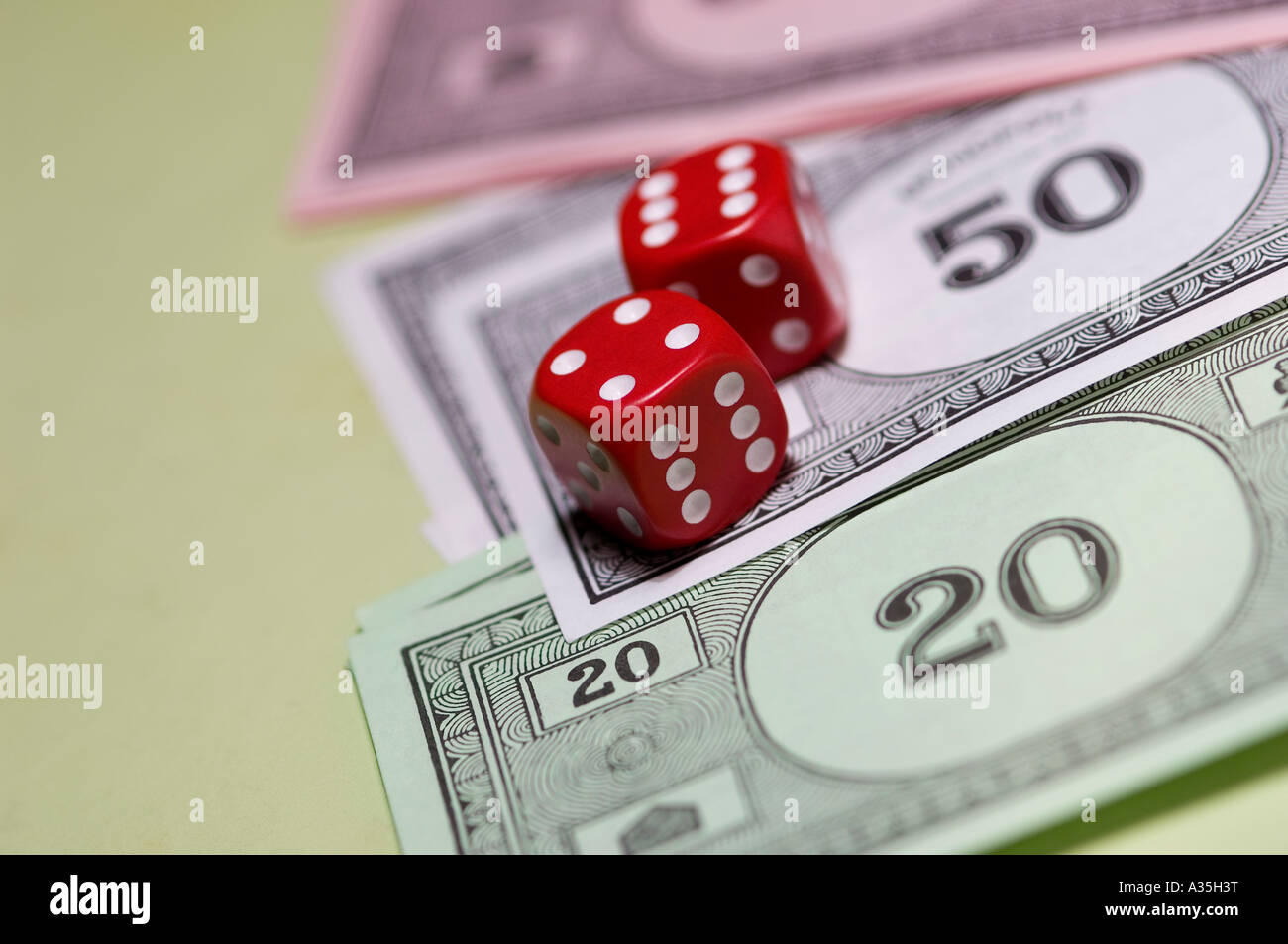 Close up of monopoly money and dice business concept cash note notes ...