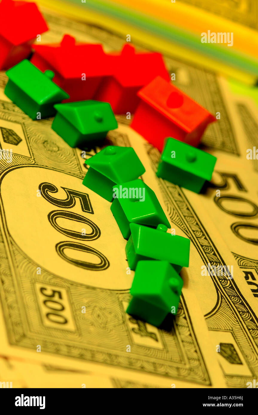 Close up of monopoly money and houses business concept cash note notes ...