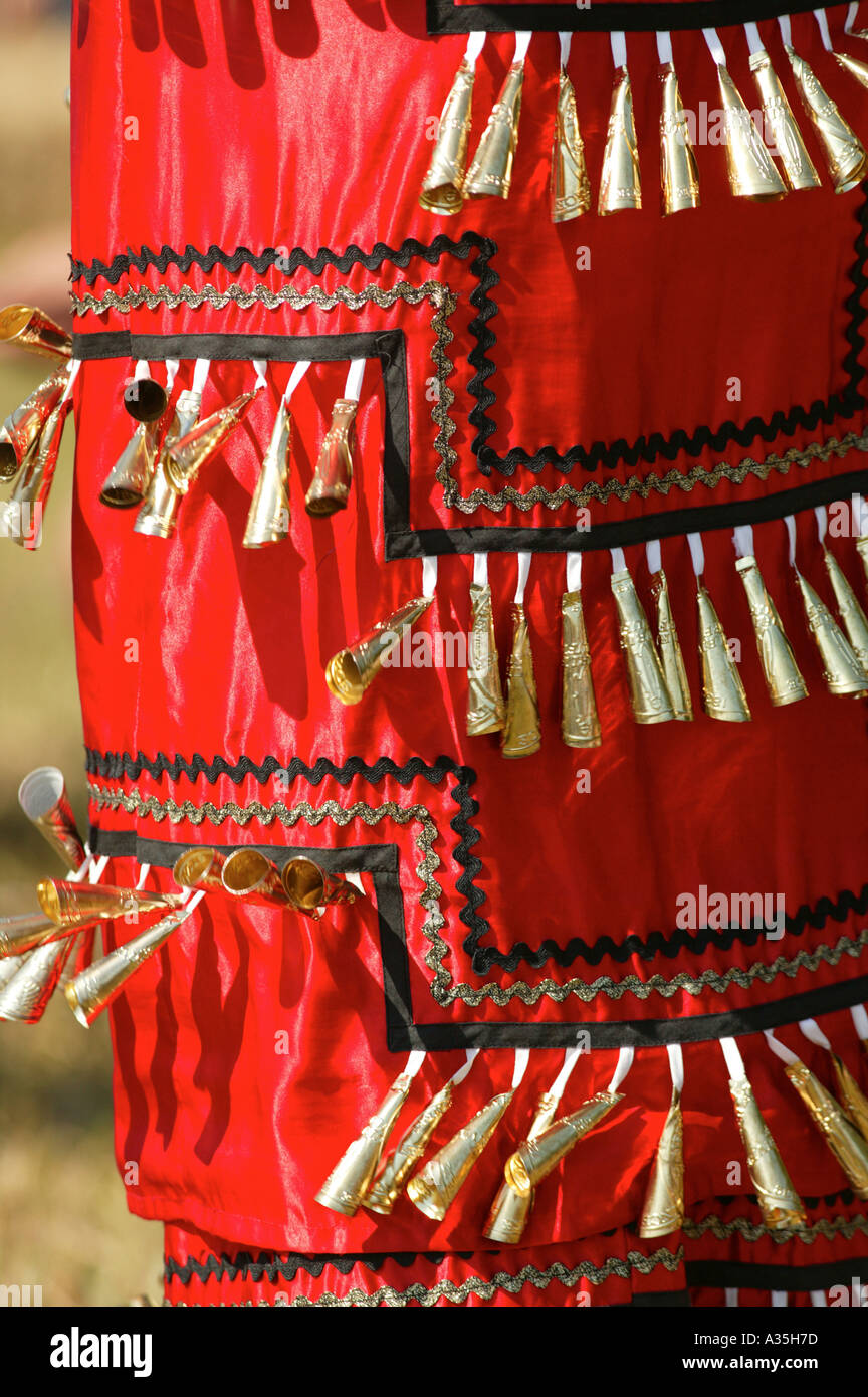 Native American tribal dance costume with red skirt and bells Stock ...