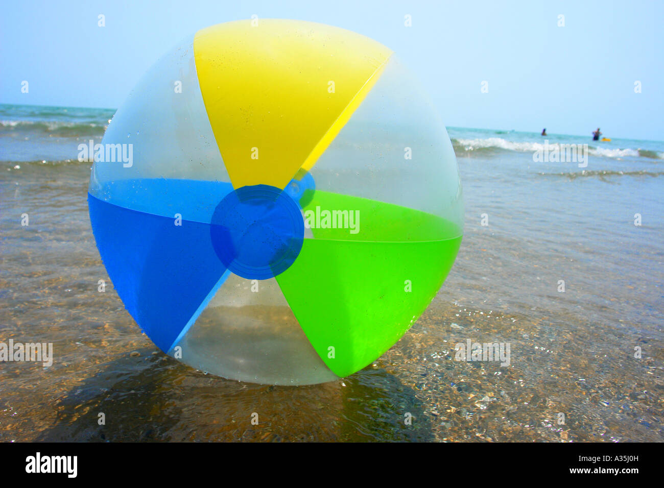 Beach ball at the ocean Stock Photo - Alamy