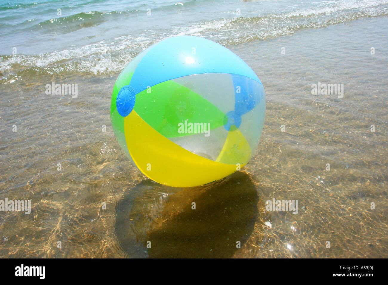 Beach ball at the ocean Stock Photo - Alamy