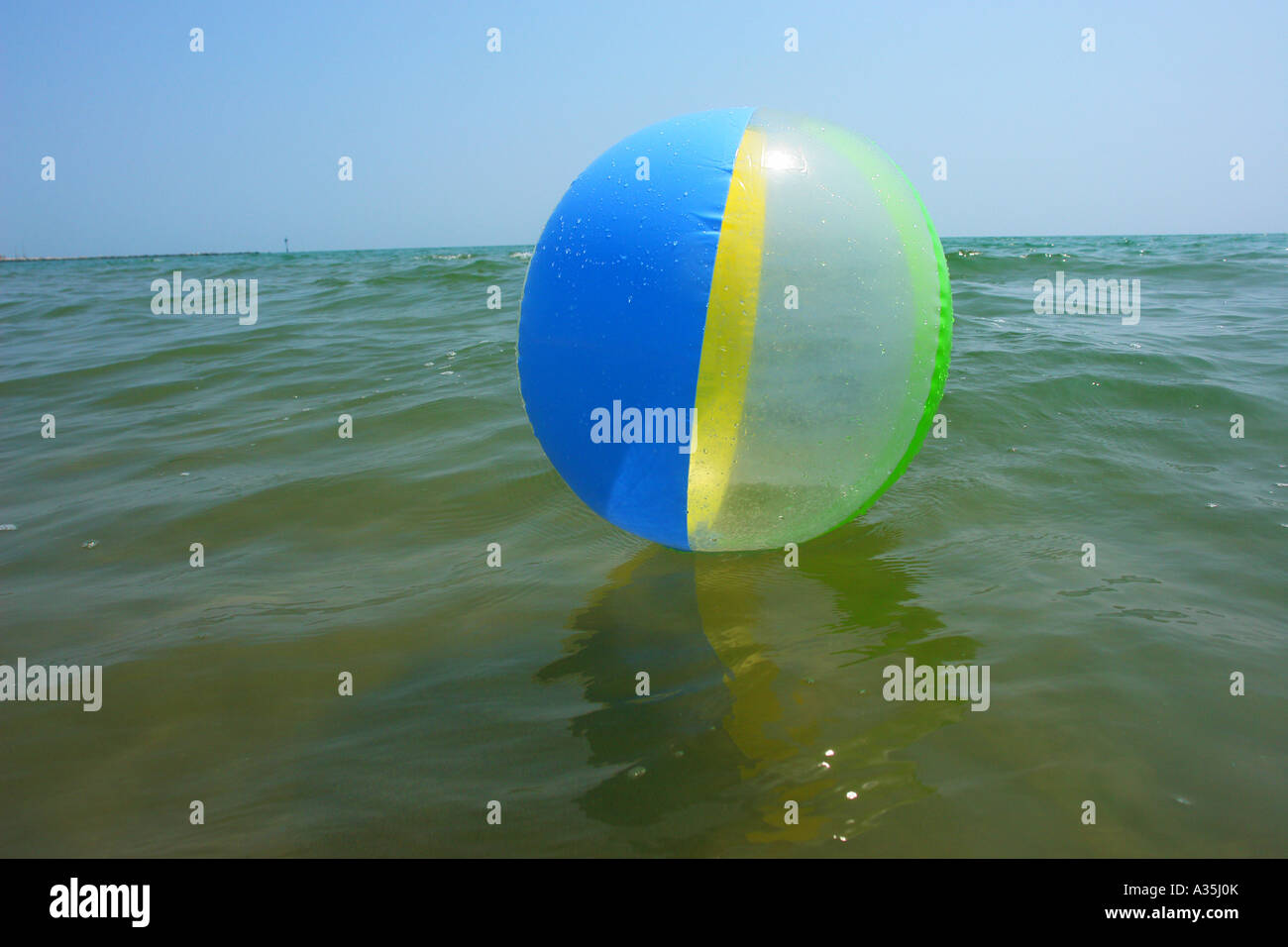 Beach ball at the ocean Stock Photo - Alamy