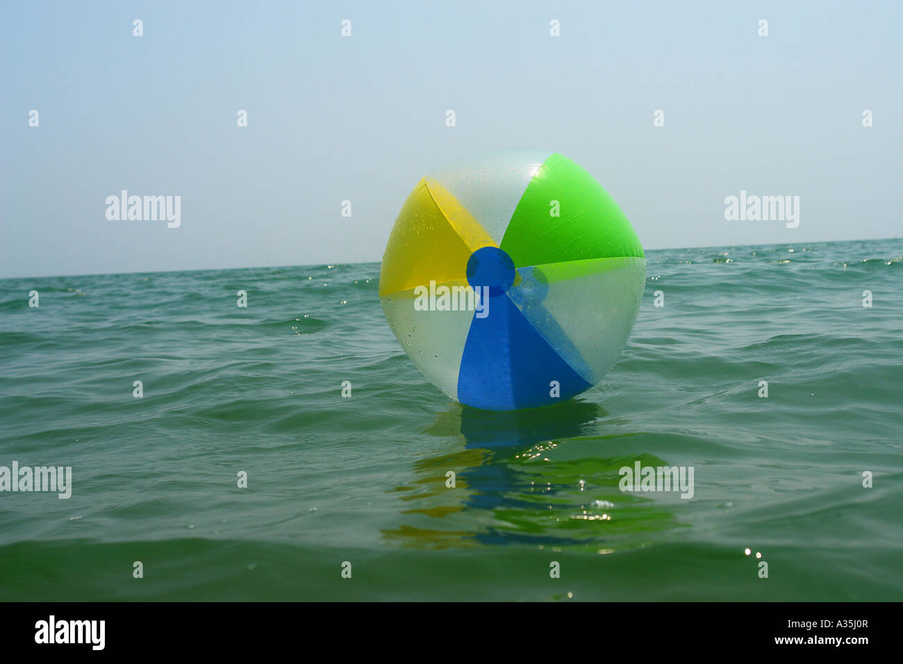 Beach ball at the ocean Stock Photo - Alamy