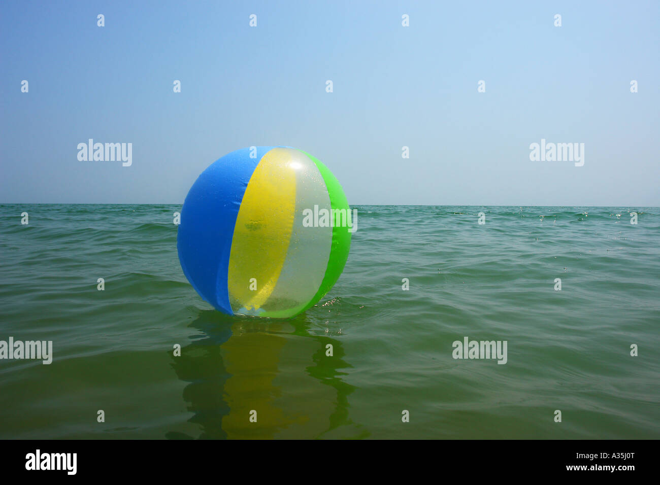 Beach ball at the ocean Stock Photo - Alamy