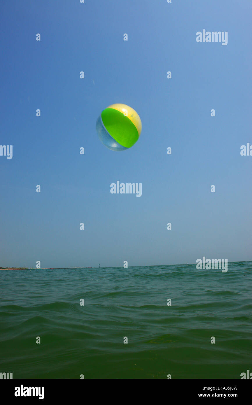 Beach ball at the ocean Stock Photo - Alamy