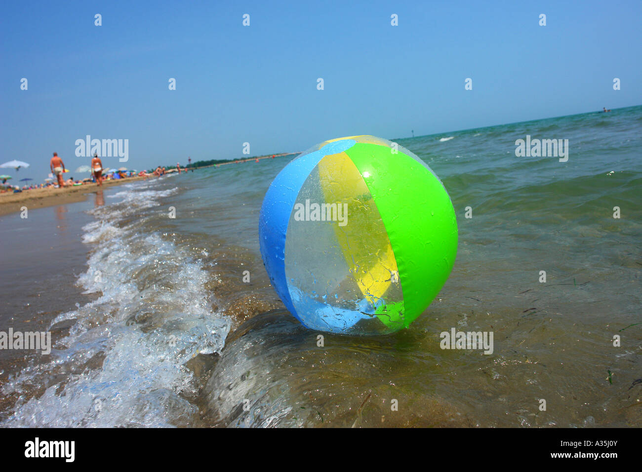 Beach ball at the ocean Stock Photo - Alamy