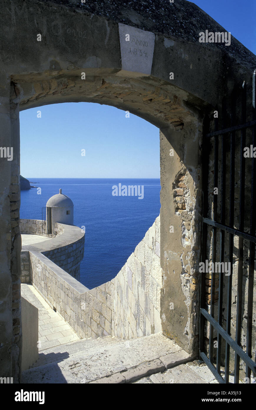 View of Turret and Old City Walls from stone Archway surrounding ...