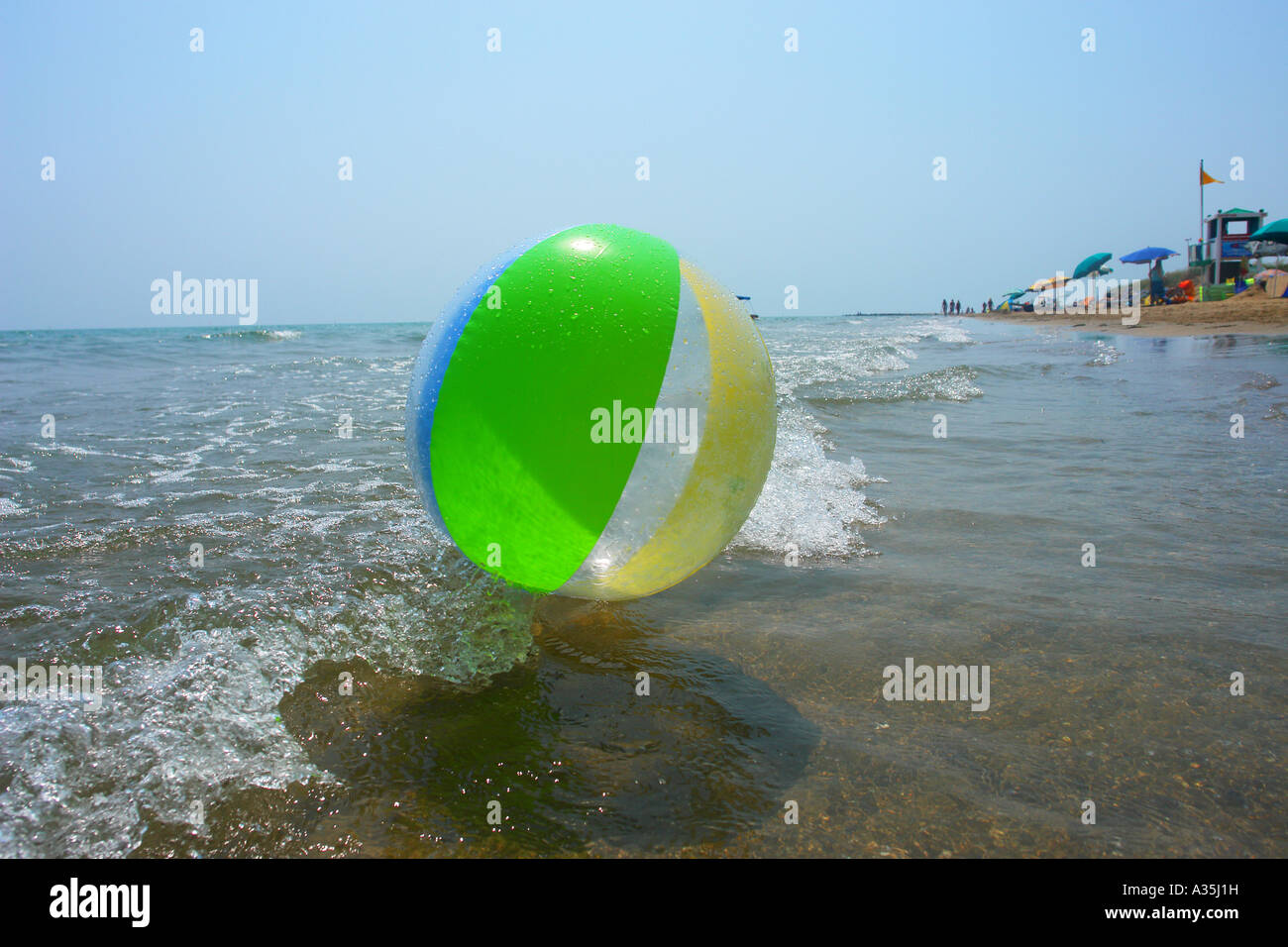 Beach ball at the ocean Stock Photo - Alamy