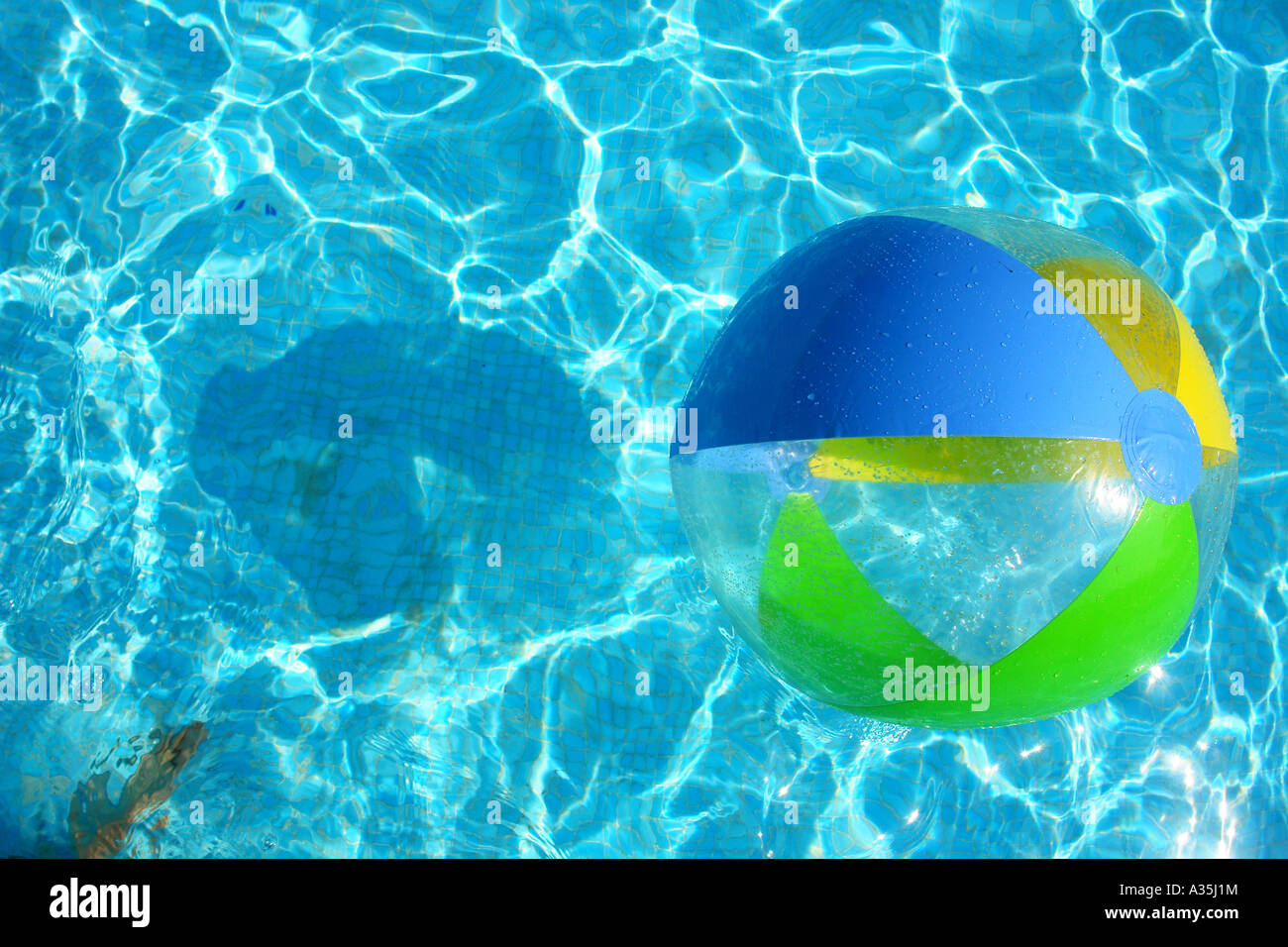 Beachball in swimming pool hi-res stock photography and images - Alamy