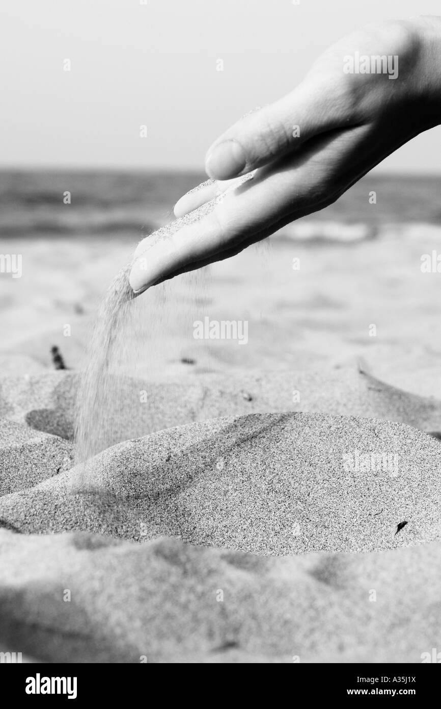sand running through hands as a symbol for time running lost etc Stock ...
