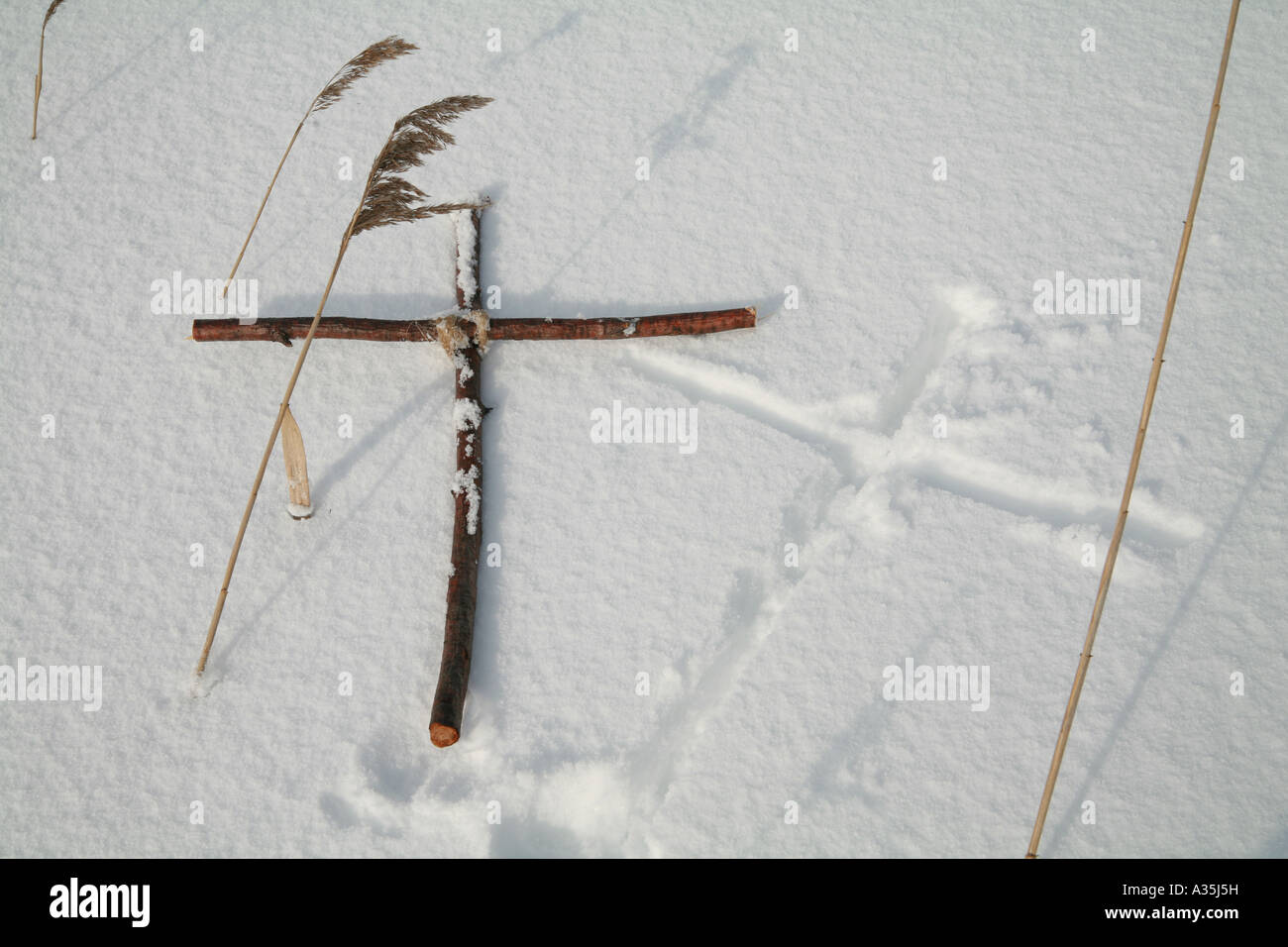 Cross in winterscene Stock Photo - Alamy