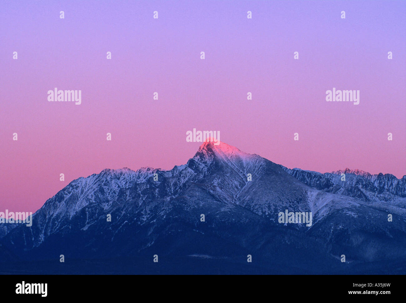 "Hot summit" The last rays of Sun warm up the snowy mount Krivan, High ...