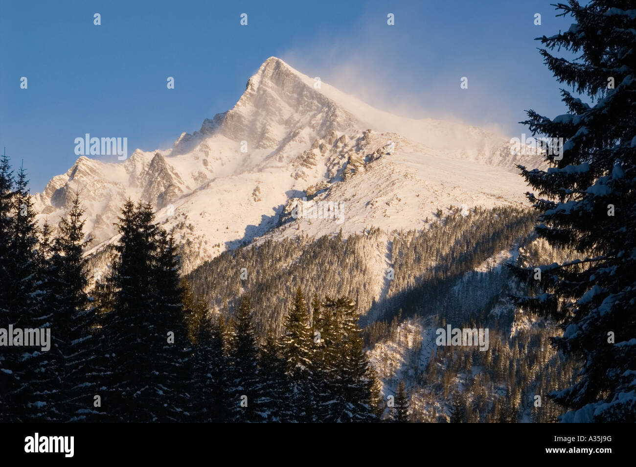 Snow covered mount Krivan with strong winds on the summit, High Tatras ...