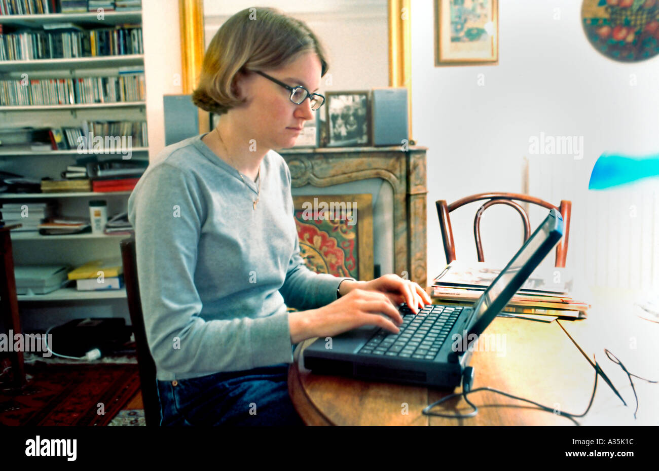 Young Adult Gritty, Woman Sitting, Looking at Laptop Computer Screen ...