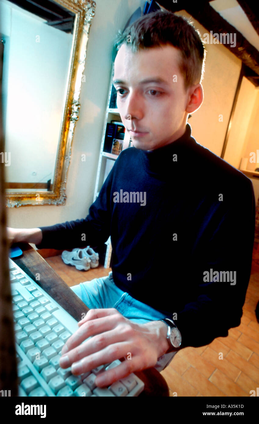 Young Adult Man Looking at Computer Screen in Home, Alone, Browsing ...